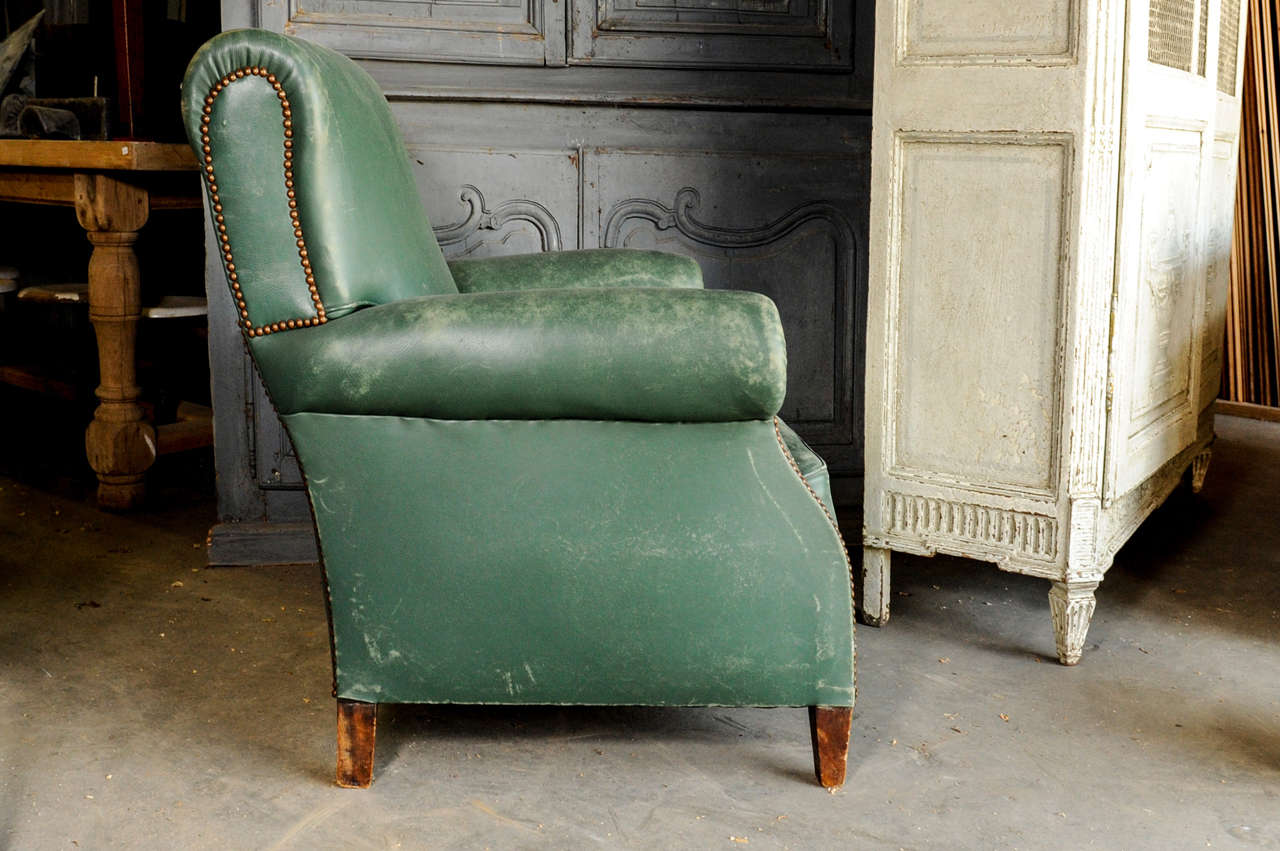 A pair of antique green leather club seats at 1stDibs