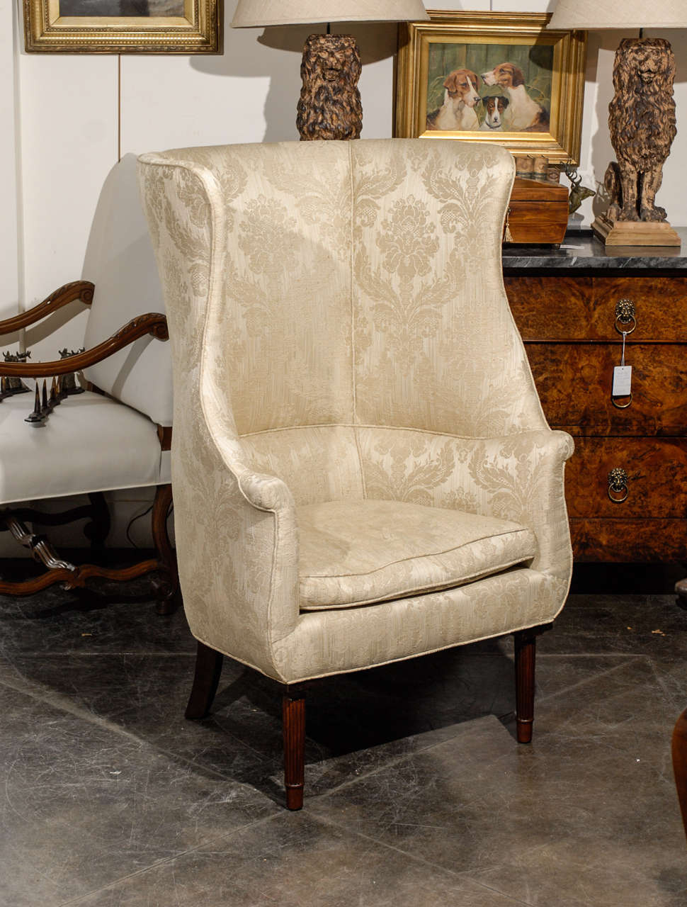 1920s Large Barrel Back Upholstered Wing Chair Raised on Four Reeded ...