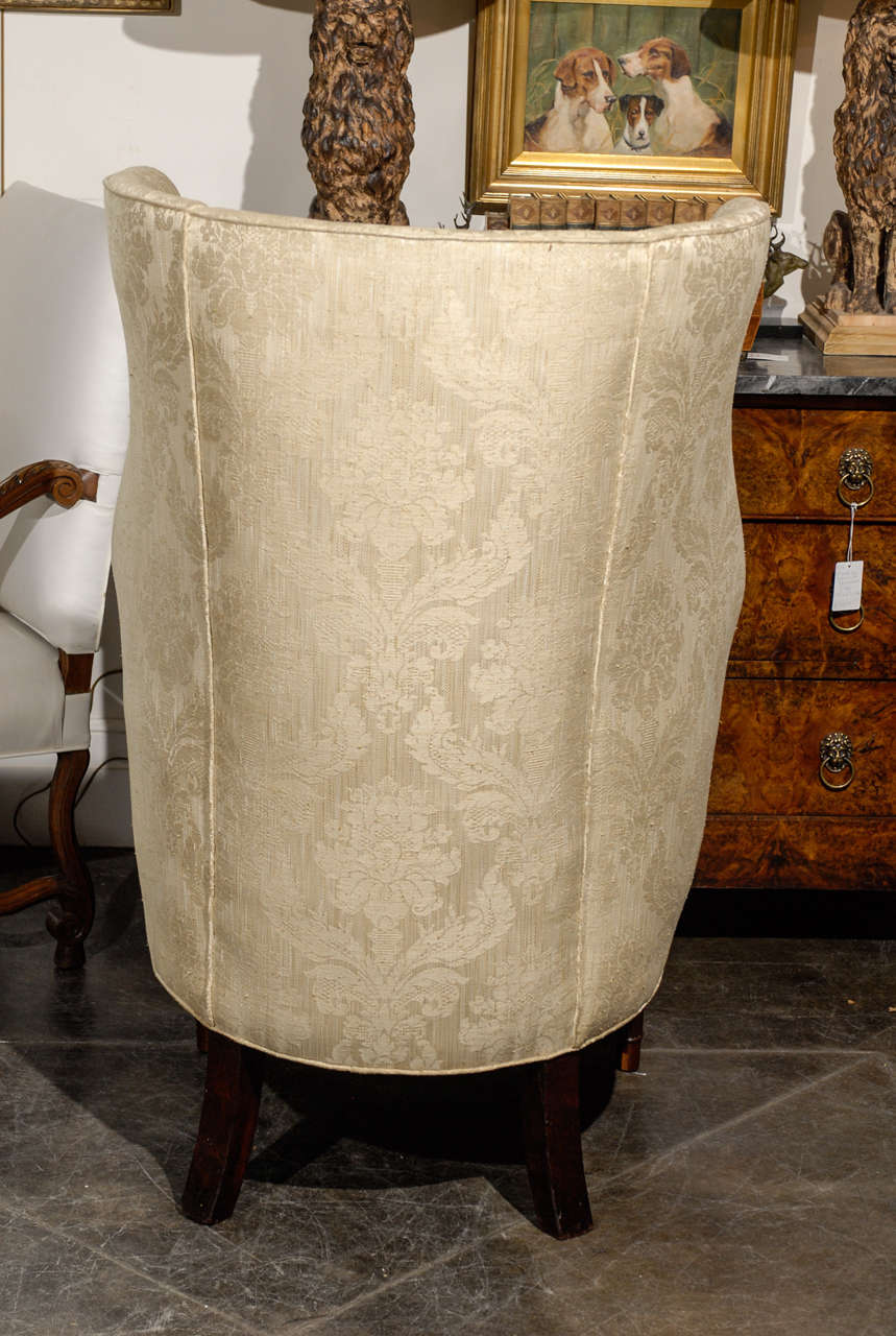 1920s Large Barrel Back Upholstered Wing Chair Raised on Four Reeded ...