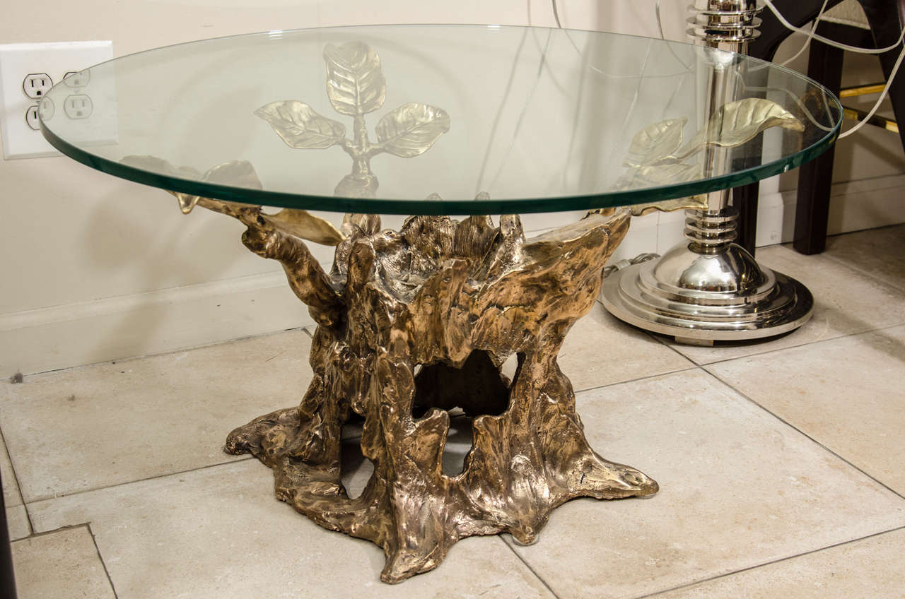 Circular glass top side table with rustic tree form bronze base at 1stDibs