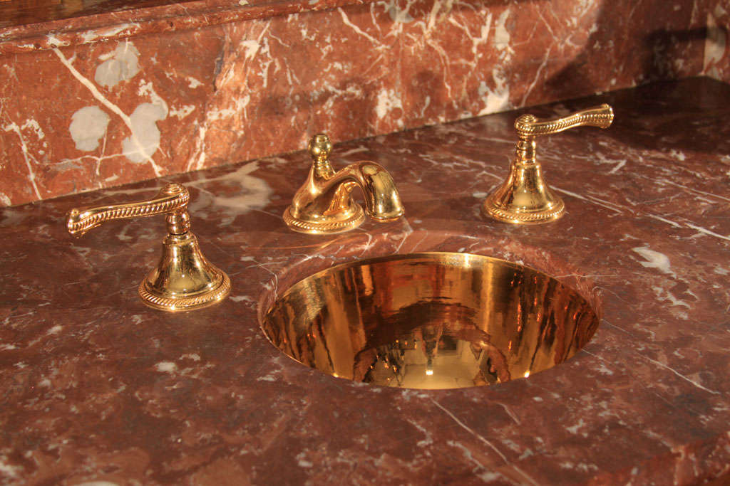 Custom marble top bath vanity with gilt sink. at 1stDibs