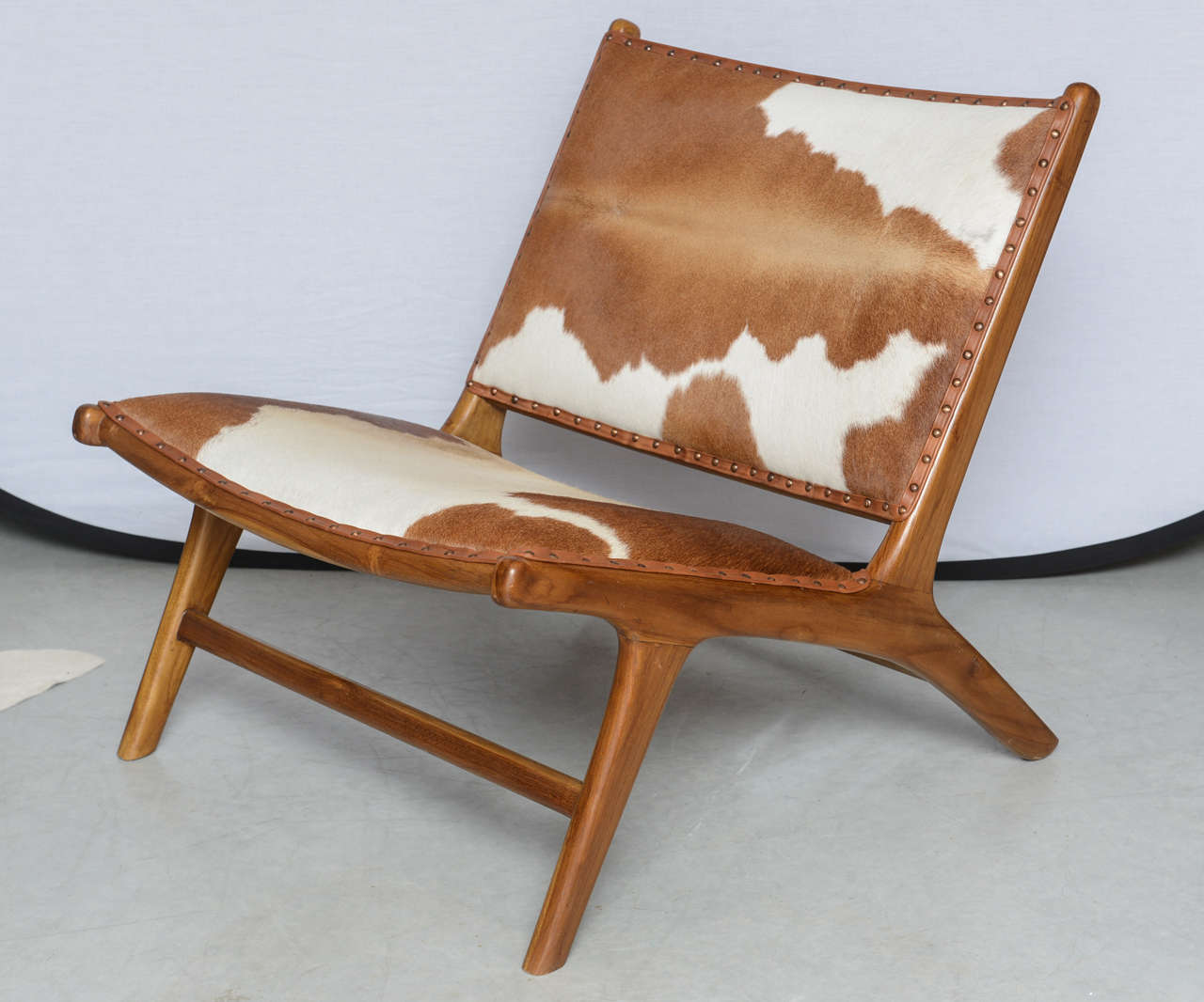 Cowhide Upholstered Teak Lounge Chair at 1stDibs