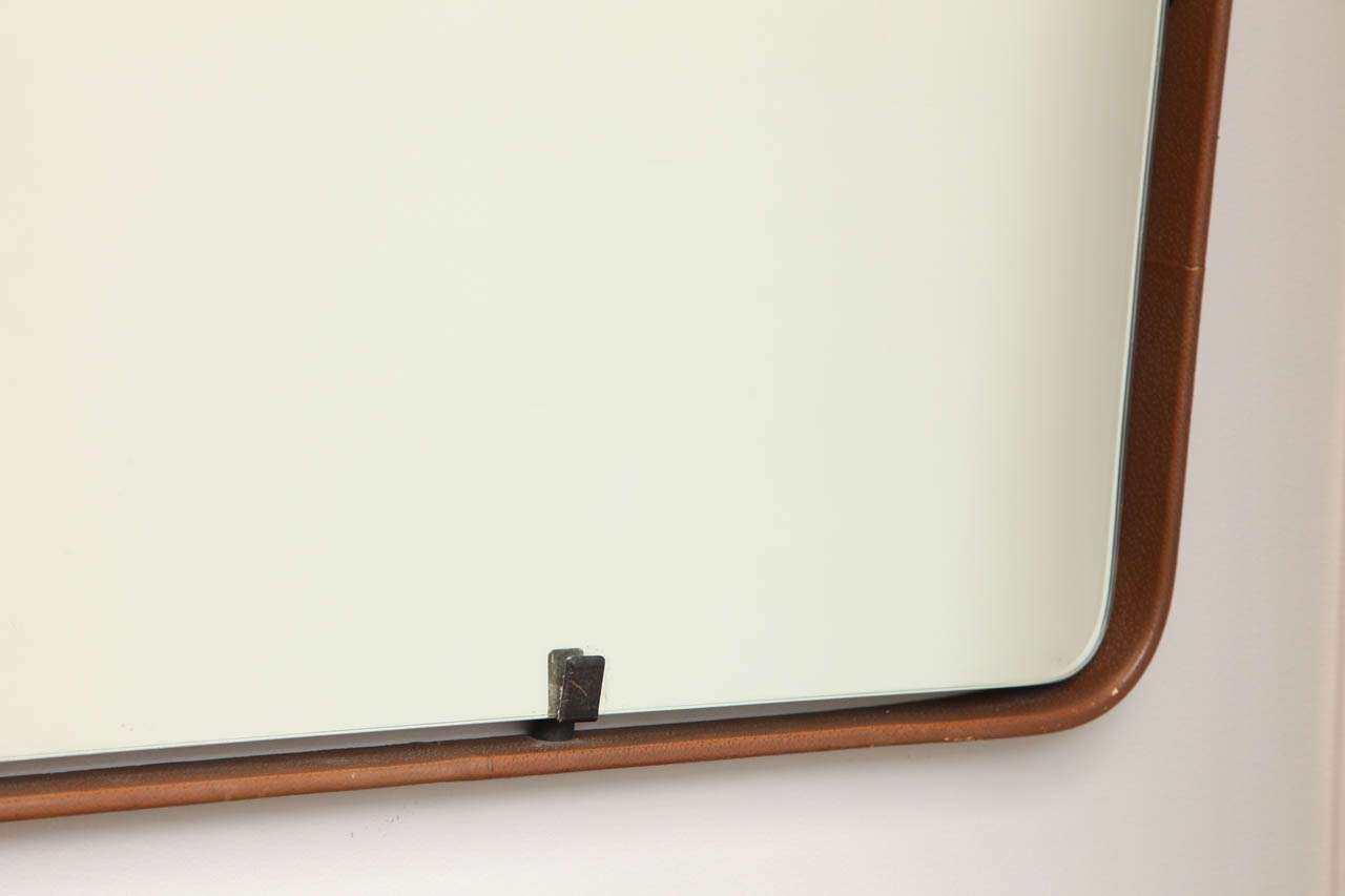 Modernist Mirror "Floating" In A Leather Wrapped Frame. For Sale at 1stDibs