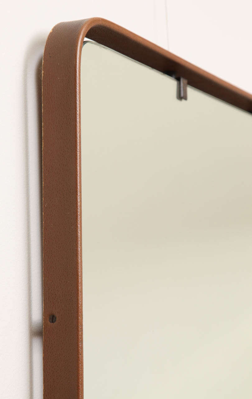 Modernist Mirror "Floating" In A Leather Wrapped Frame. For Sale at 1stDibs