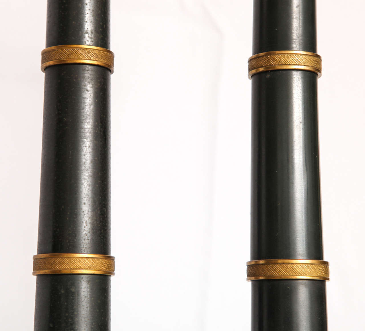 Pair of Gilt and Patinated Metal Banded Column Lamps at 1stDibs