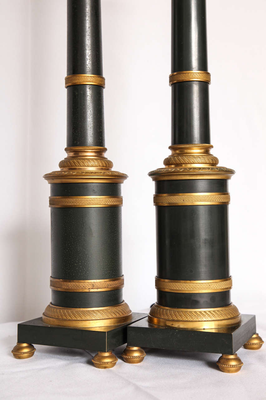 Pair of Gilt and Patinated Metal Banded Column Lamps at 1stDibs