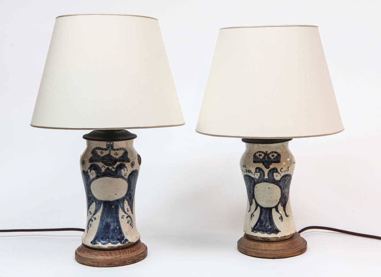 A rare pair of Mexican Talavera Albarello jars, mounted as lamps at ...