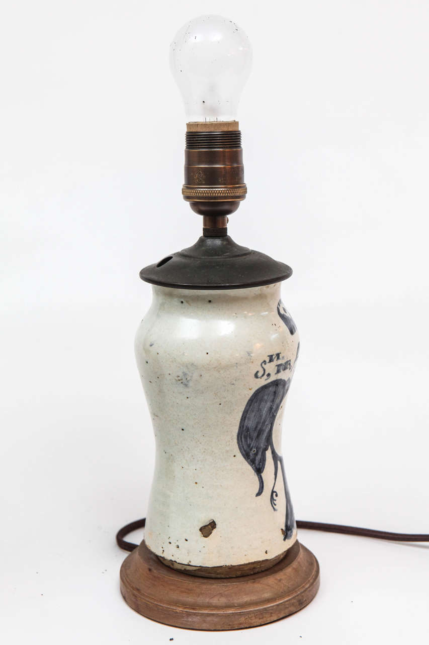 A rare pair of Mexican Talavera Albarello jars, mounted as lamps at ...