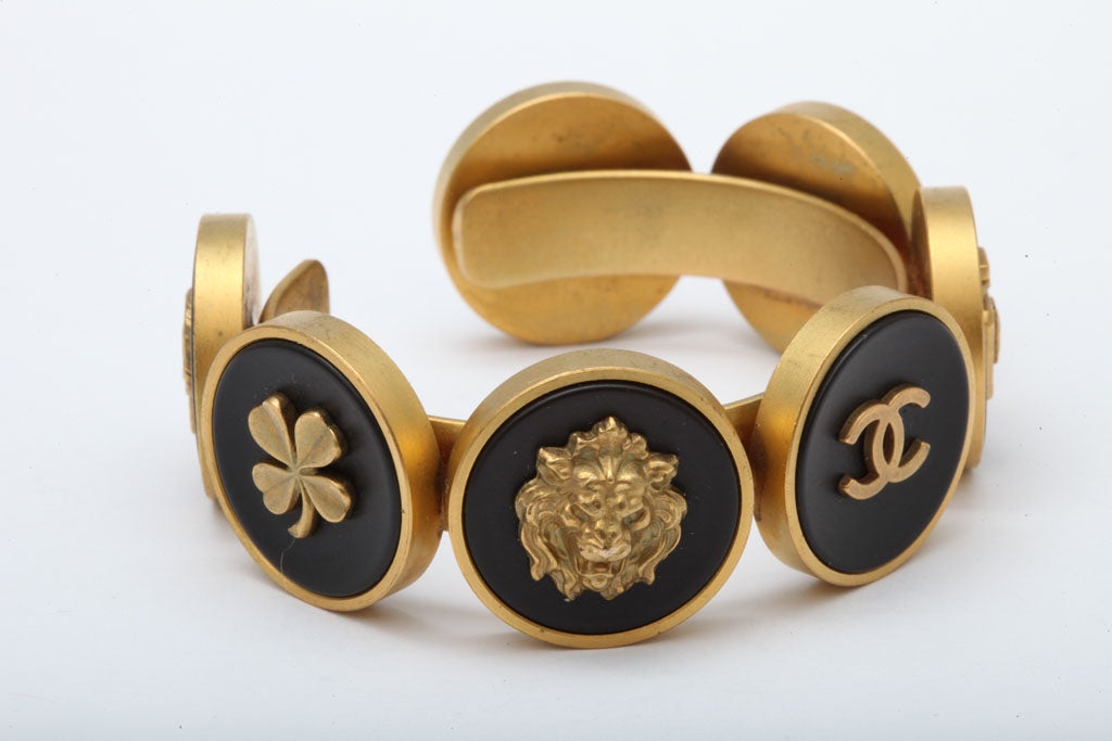 CHANEL BLACK/GOLD ICONIC MOTIF BANGLE at 1stDibs