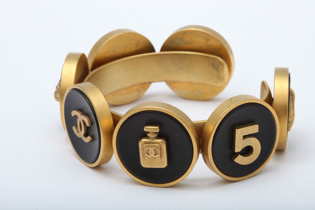 CHANEL BLACK/GOLD ICONIC MOTIF BANGLE at 1stDibs