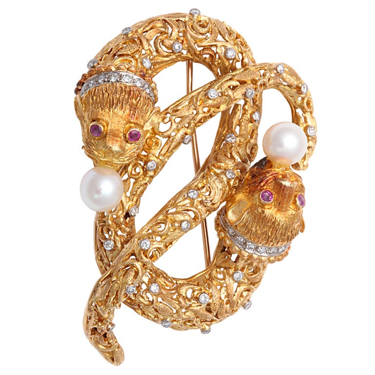 Gold intertwined Lion Head Brooch Lalaounis at 1stDibs