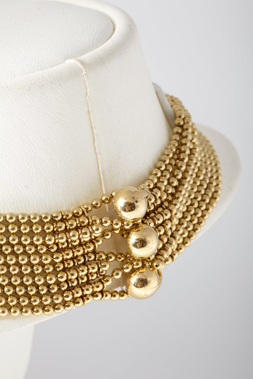A gold and diamond draperie ball necklace by Cartier at 1stDibs