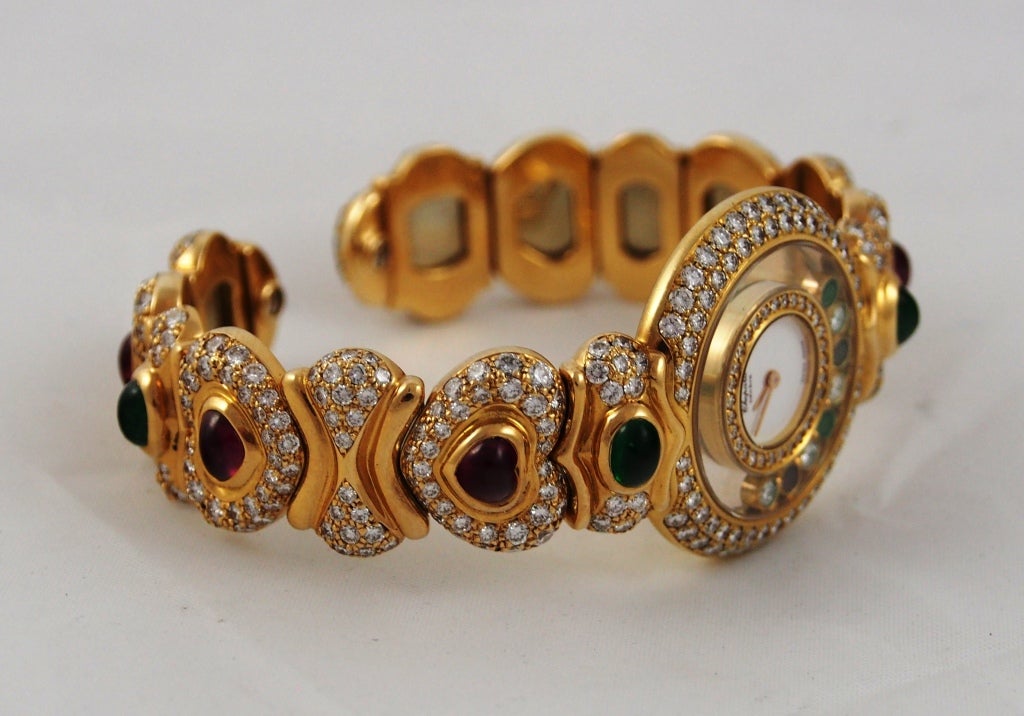 CHOPARD Yellow Gold, Diamond, Ruby Happy Diamonds Bangle Watch at 1stDibs