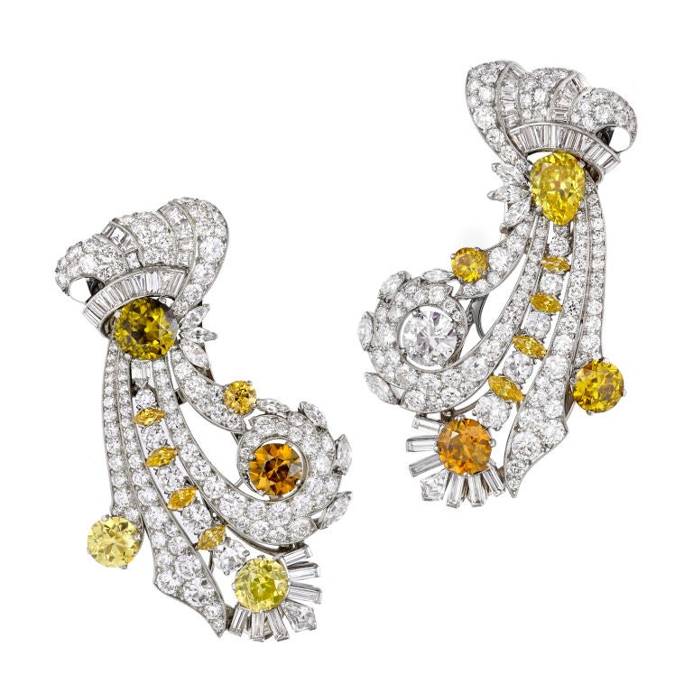 RAYMOND YARD Pair of Art Deco Canary diamond scroll clips at 1stDibs