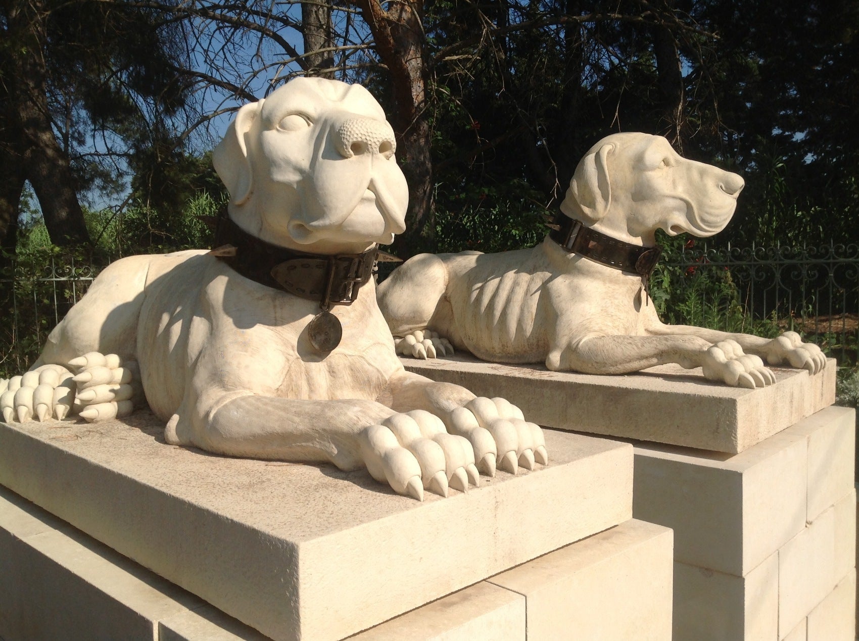 Handed Pair of Cast Stone Roman Dogs on Plinths For Sale at 1stDibs