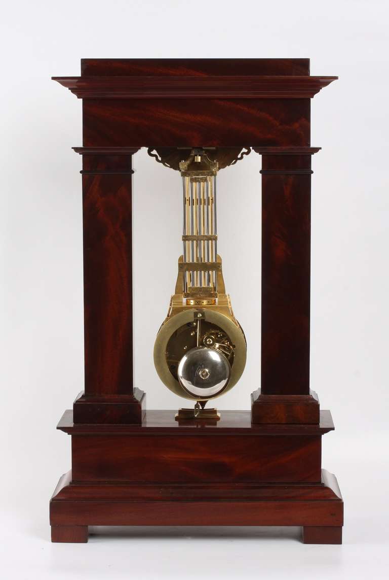 A French late-Empire mahogany and ormolu oscillating mantel clock ...