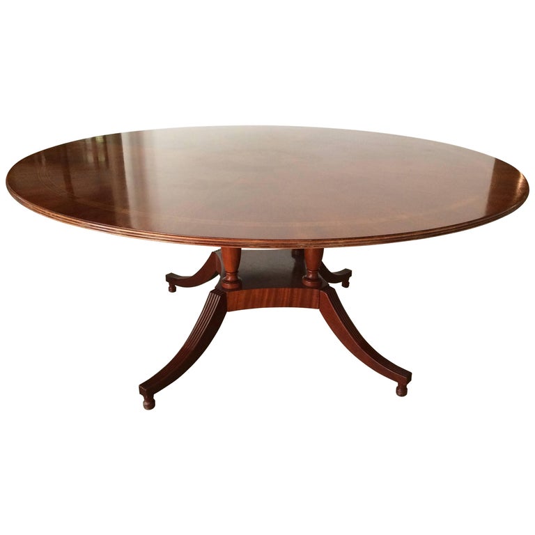 Elegant Large Round Mahogany Dining Table by Baker at 1stDibs