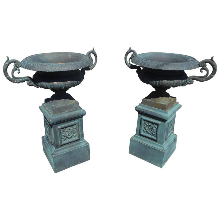 Pair of Cast Iron Urns on Pedestal Bases at 1stDibs