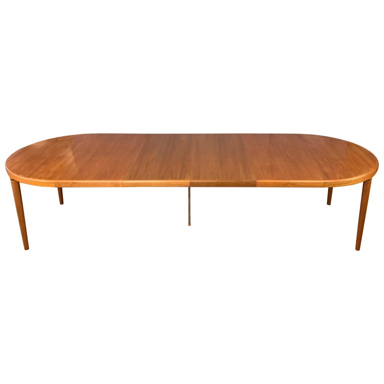 Expansive Danish Modern Extendable Teak Dining Table at 1stDibs