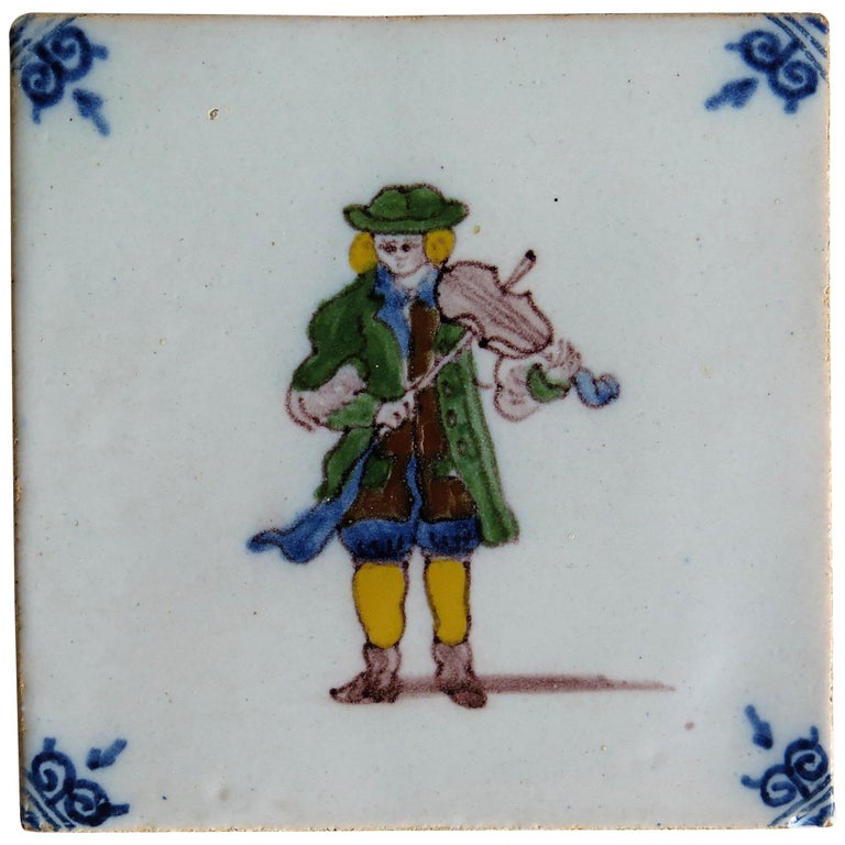 A 19th Century Dutch Delft Ceramic Wall Tile of a Violin Player at 1stDibs
