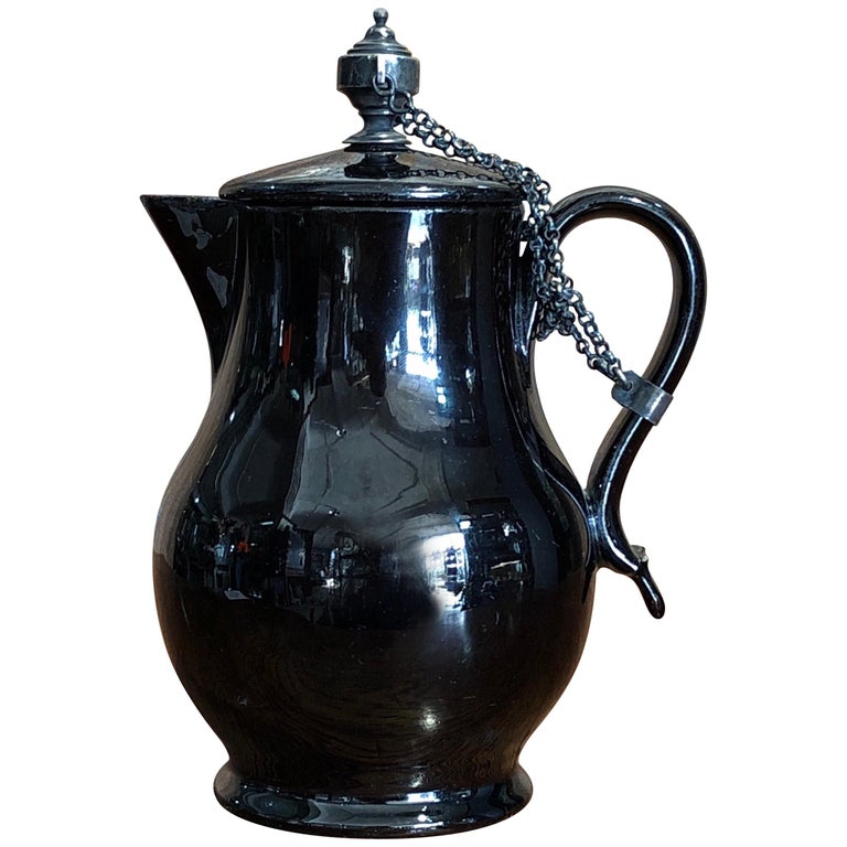 Jackfield Glaze Jug and Cover, Silver Urn Knop and Animal Head Terminal ...