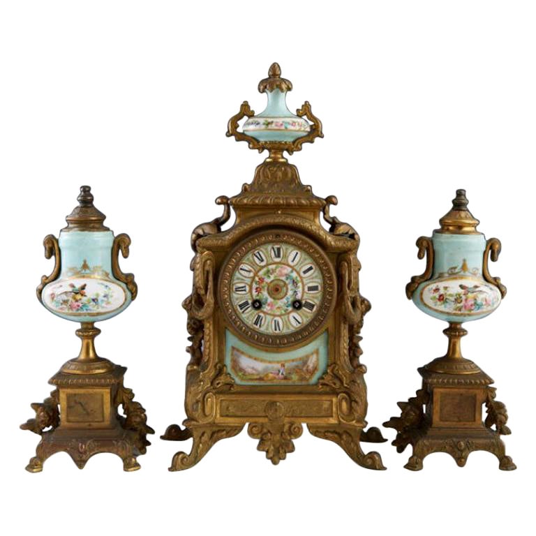 Three-Piece Gilt Porcelain Clock Set For Sale at 1stDibs