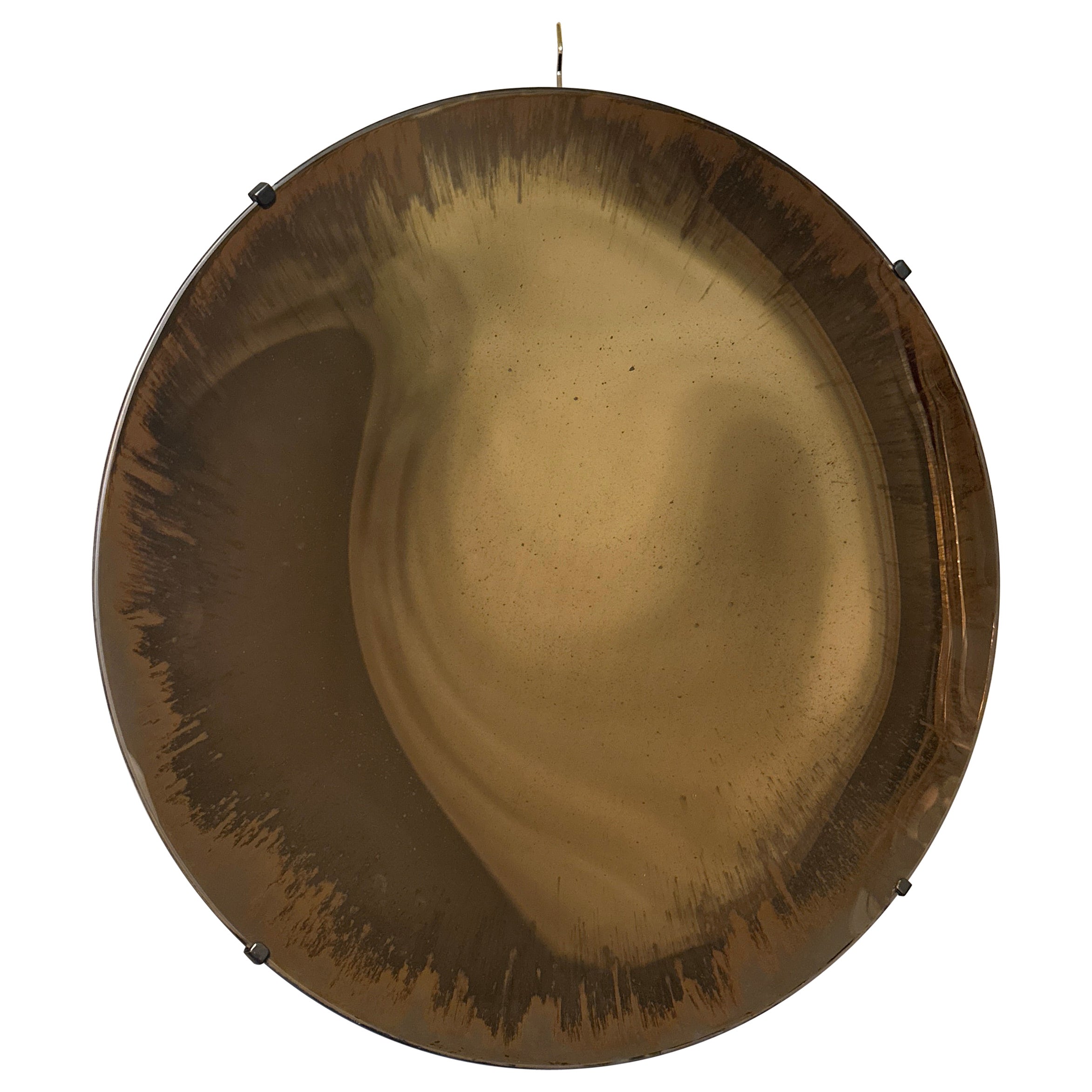A Bronze Distressed Concave Circular Mirror at 1stDibs