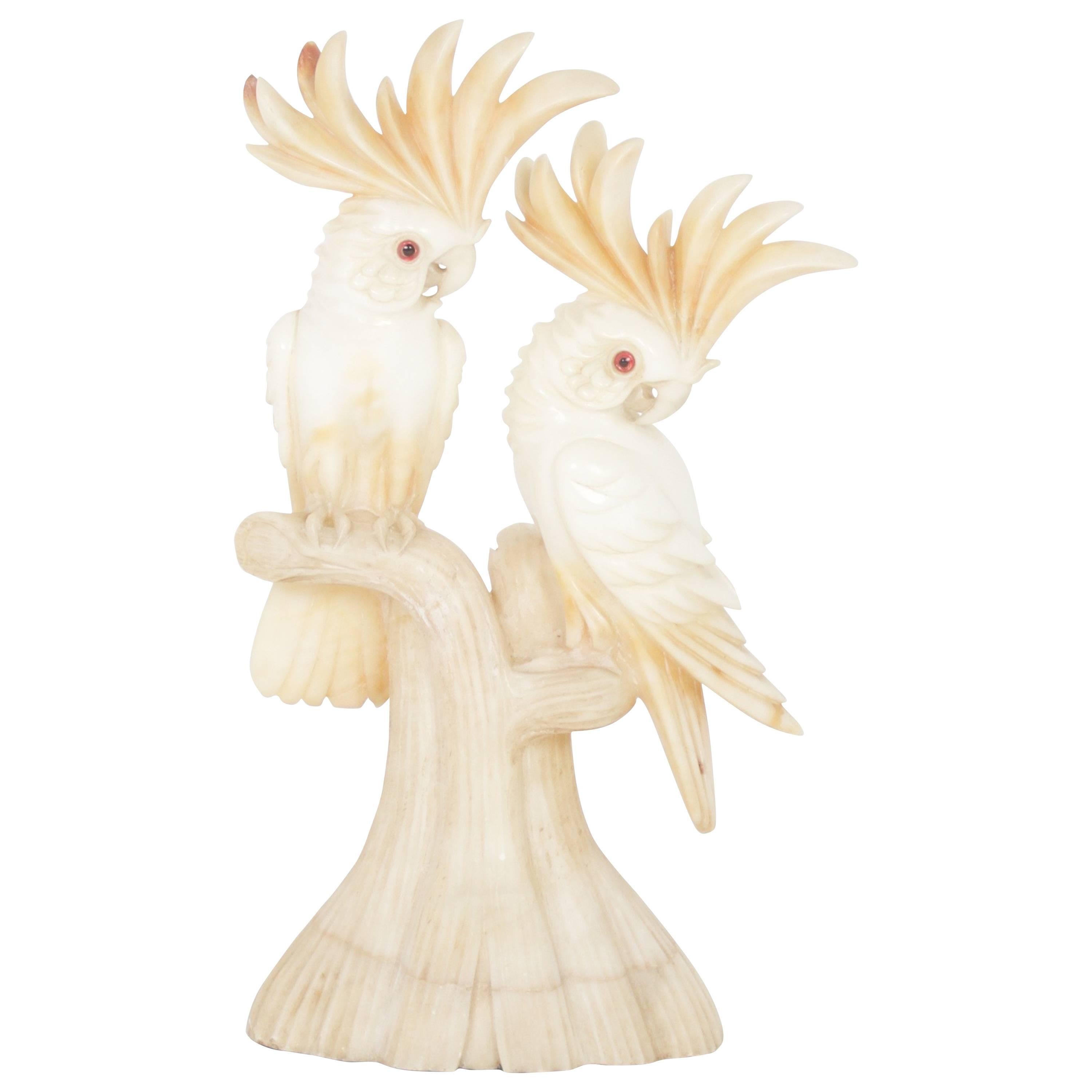 Two Spirited Carved Alabaster Cockatoos Perched on a Branch at 1stDibs