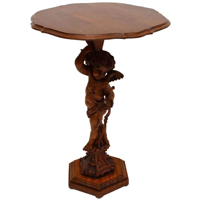 Antique Carved Cherub Mounted Table at 1stDibs