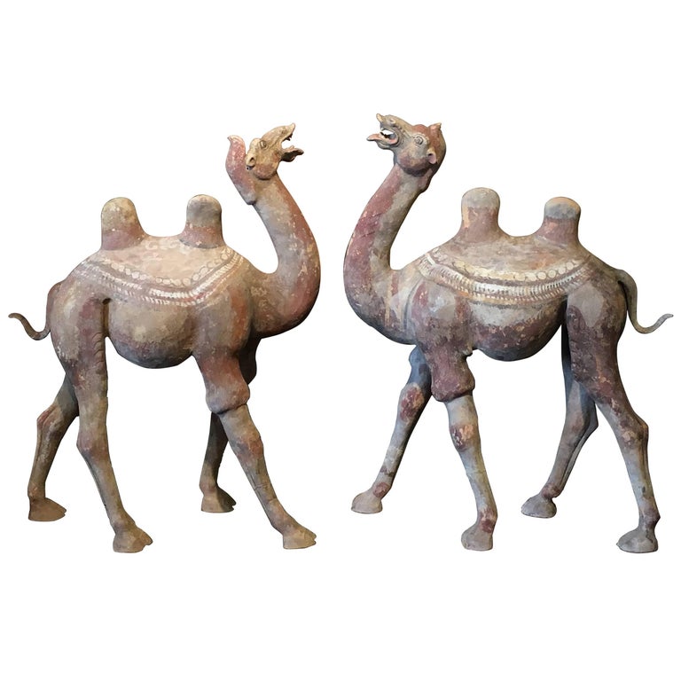 Pair of Chinese Tang Dynasty Painted Pottery Striding Camels at 1stDibs