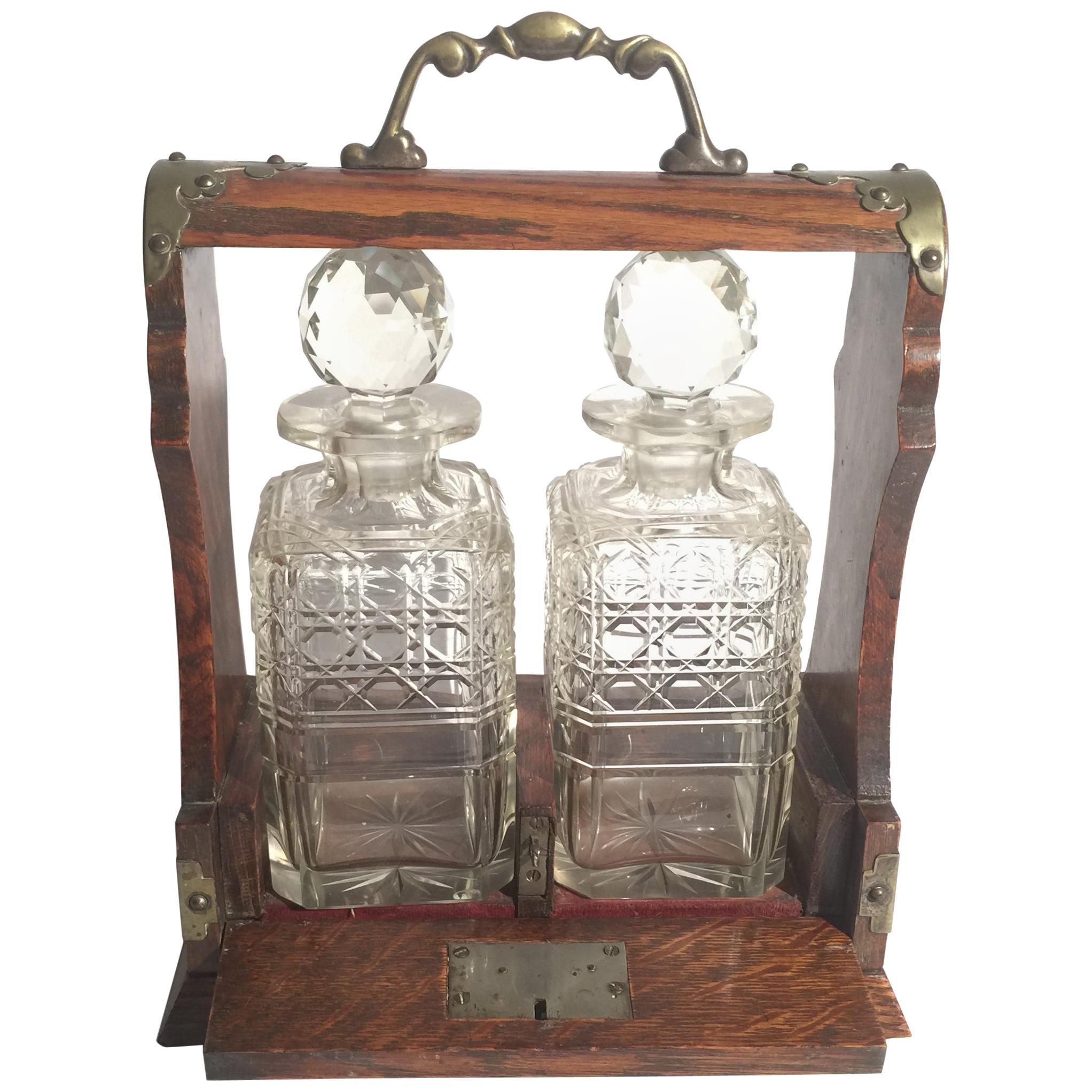 English Oak Tantalus with Two Cut Glass Decanters at 1stDibs