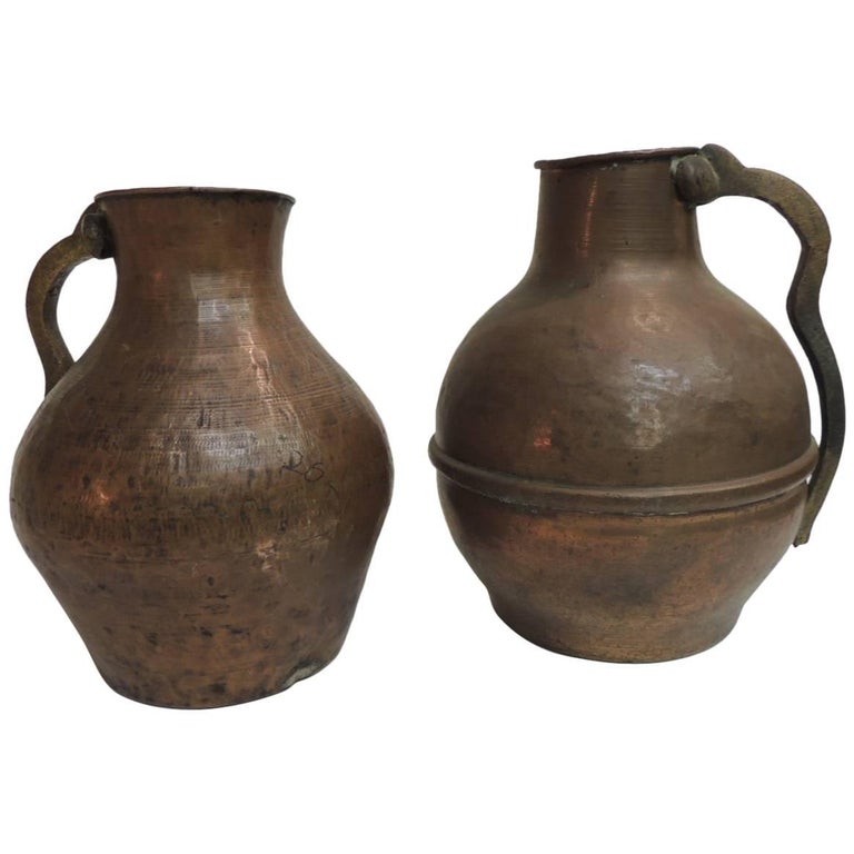 Pair of Heavy Patina Persian Copper Water Jugs with Handles at 1stDibs