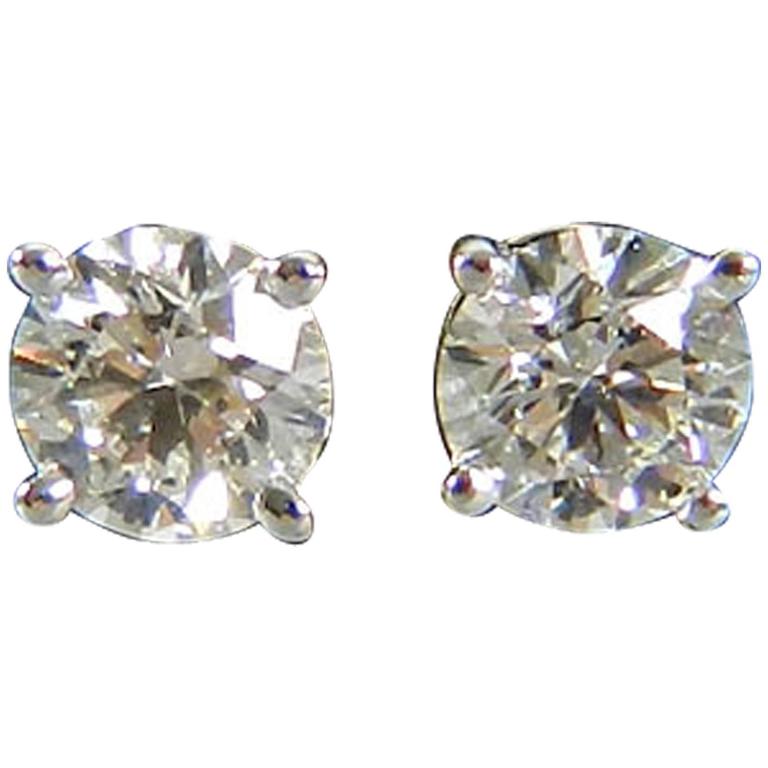 Tiffany and Co. Diamond Platinum Solitaire Stud Earrings at 1stDibs