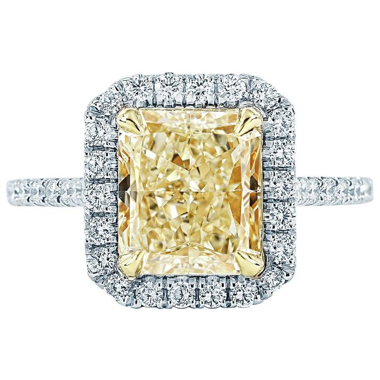 3.62 GIA cert Radiant Fancy Yellow diamond Gold Halo Engagement Ring For Sale at 1stDibs