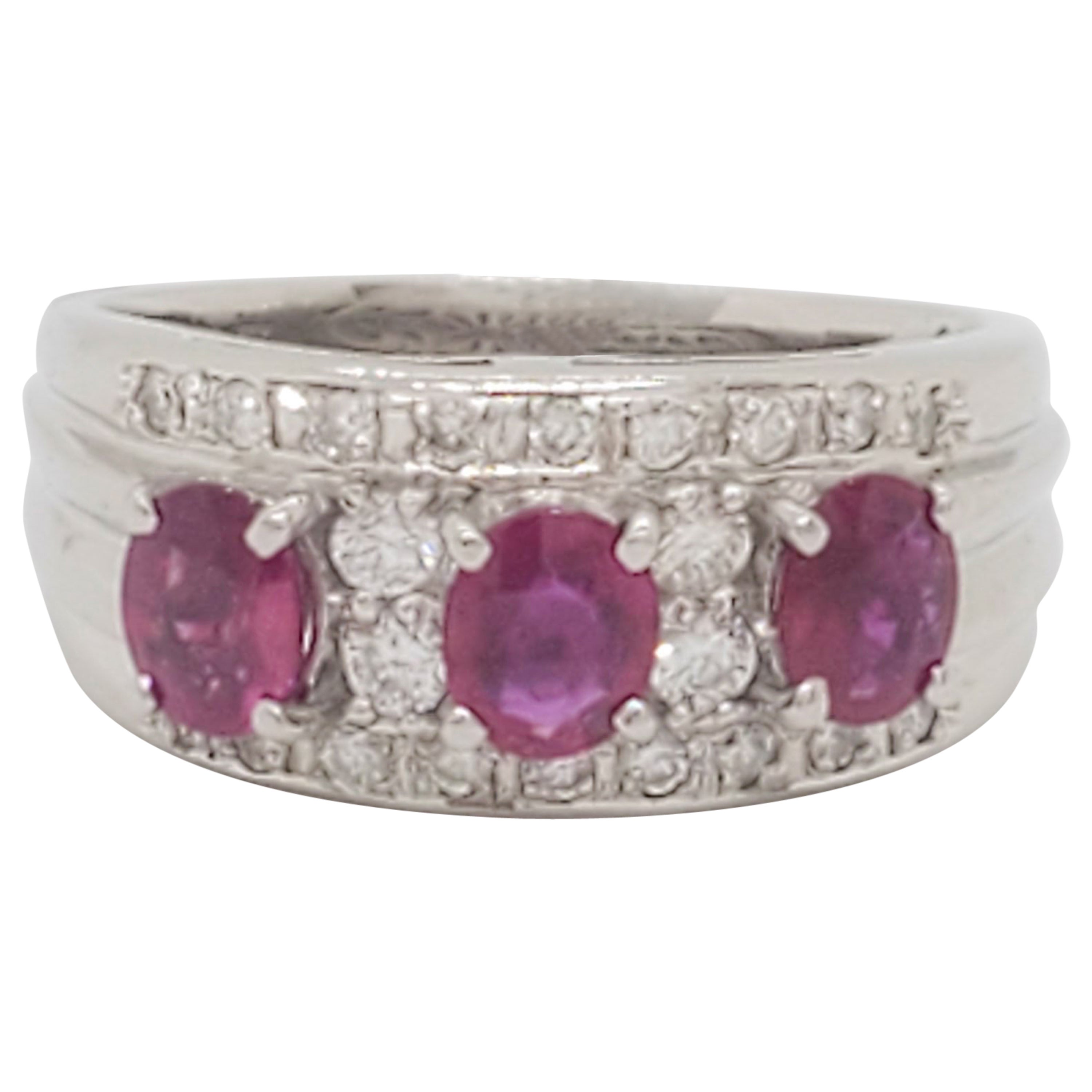 MFCO22 Estate Platinum Round/Tapered Baguette Diamonds and Ruby Oval Ring at 1stDibs