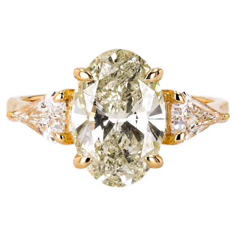 3.23 Carat Champagne Oval Three Stone Ring For Sale at 1stDibs