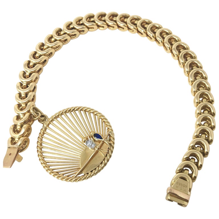 1970s Van Cleef and Arpels Iconic Gold Charm Bracelet at 1stdibs