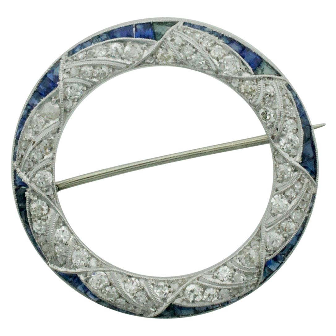 1920s French emerald and diamond open circle brooch at 1stDibs