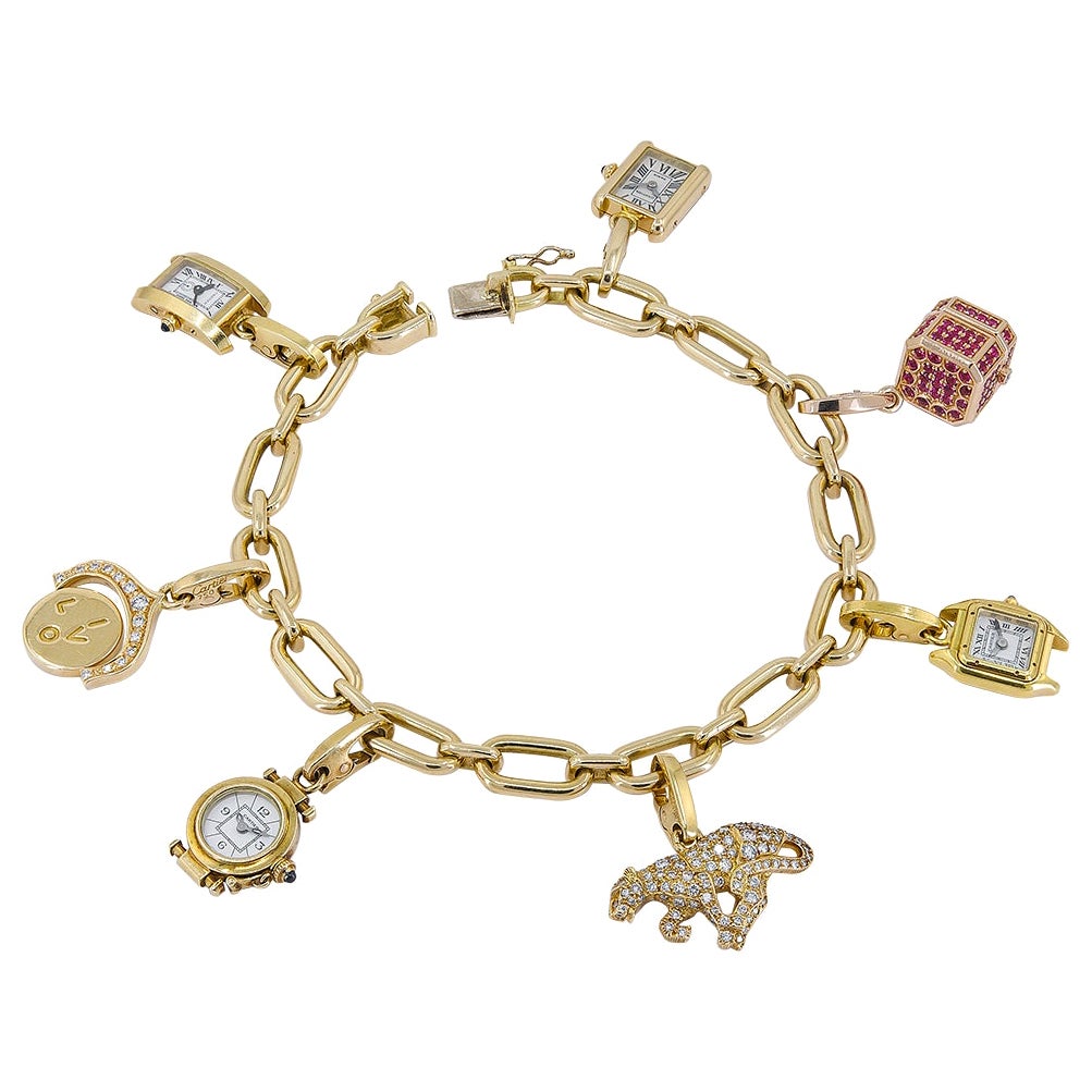 1950s Gold Multi Charm Bracelet With Cartier Charm at 1stDibs