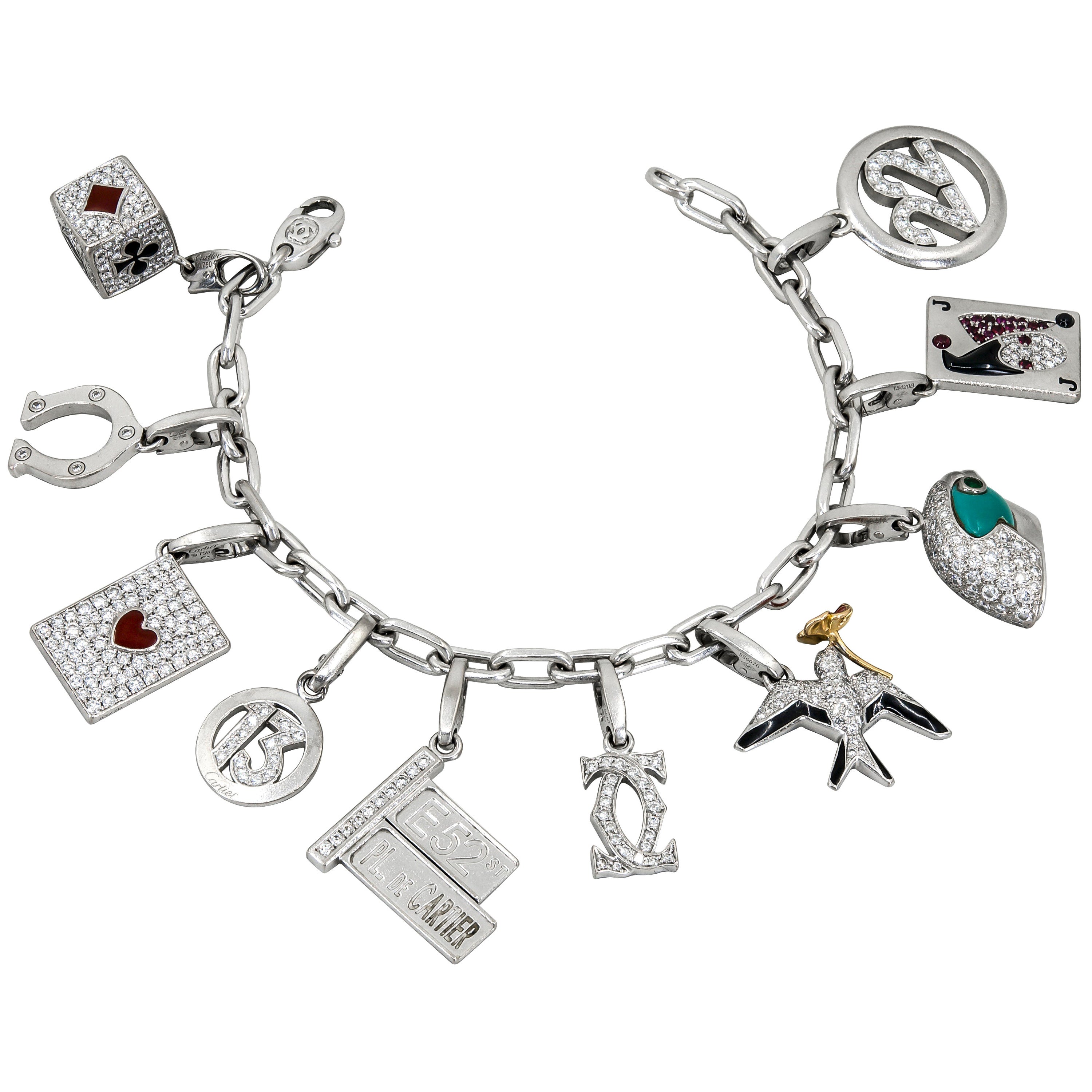 1950s Gold Multi Charm Bracelet With Cartier Charm at 1stDibs