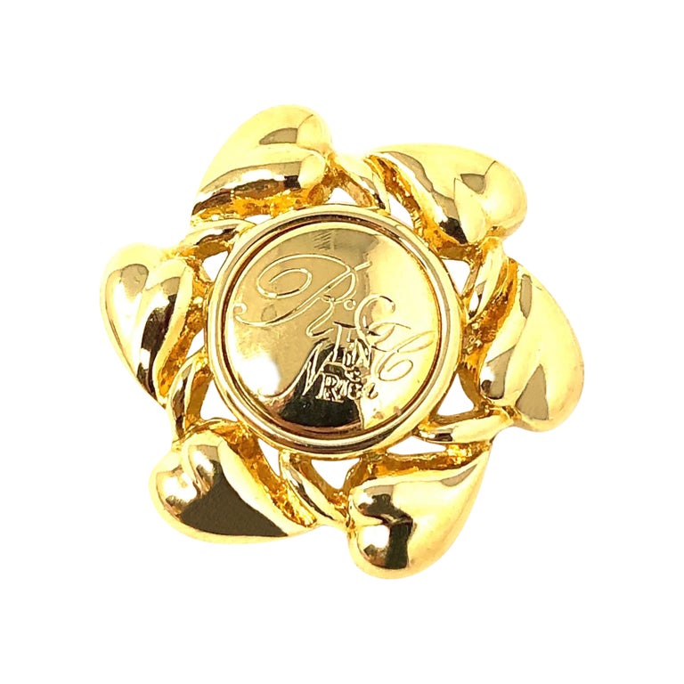 Nina Ricci Round Star Gold Tone Brooch For Sale at 1stDibs