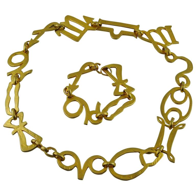 Kenzo Vintage Gold Tone Zodiac Necklace and Bracelet Set at 1stDibs