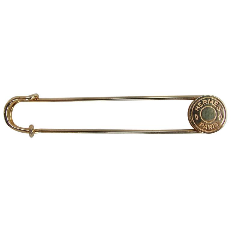 Hermes Golden Pin Brooch at 1stDibs