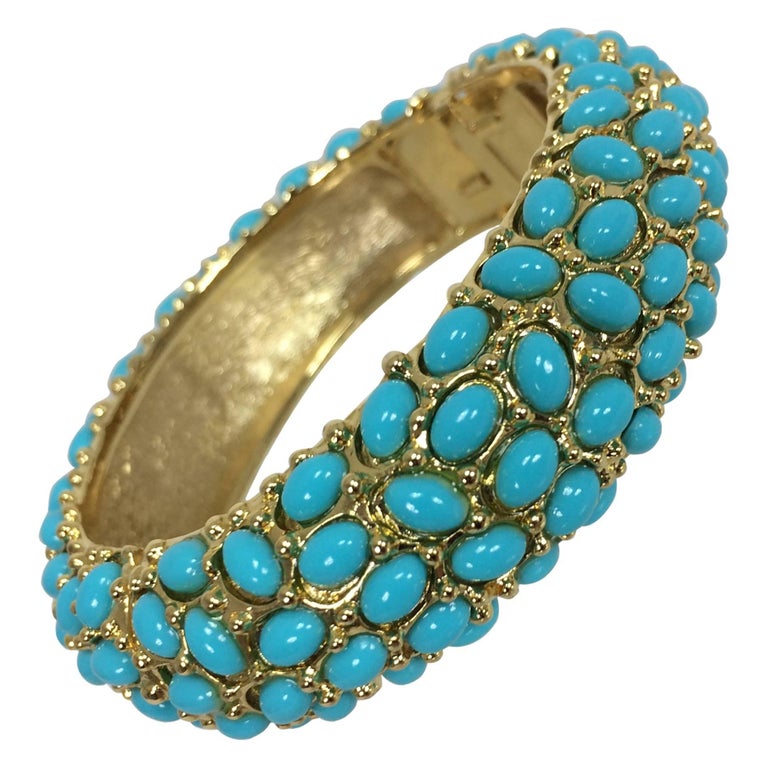 Kenneth Lane turquoise cabochon encrusted gold clamper bracelet at 1stDibs