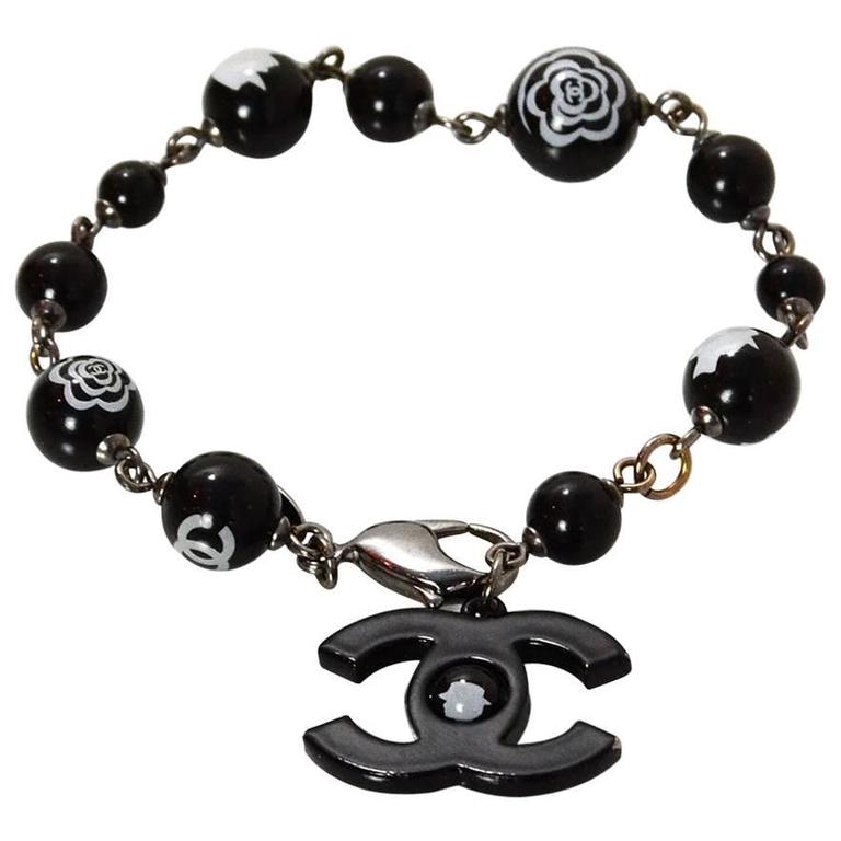 Chanel Black and White Camellia CC Bracelet For Sale at 1stDibs