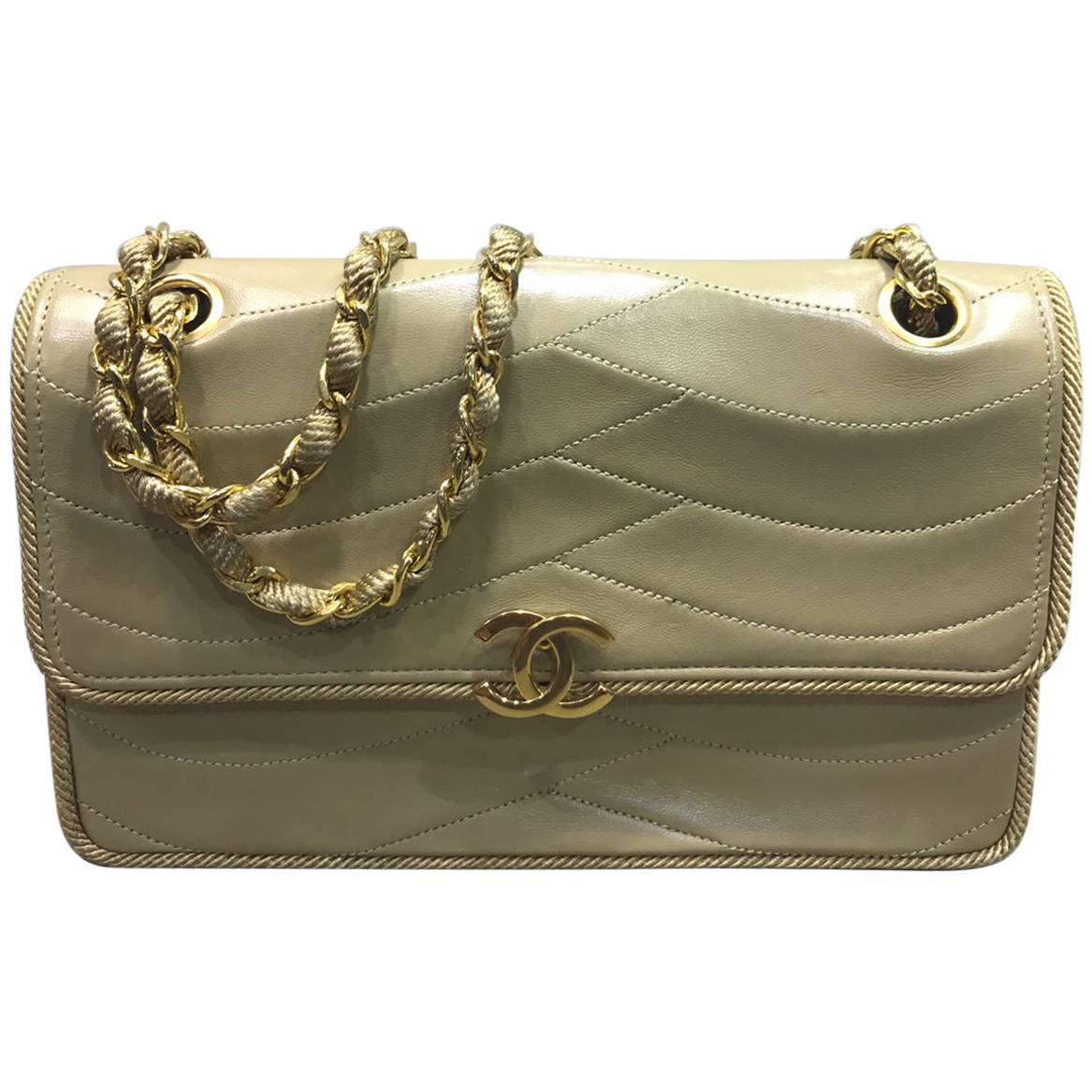 Chanel Early 90s Beige Lambskin Gold Chain Flap Bag at 1stDibs | 90's ...
