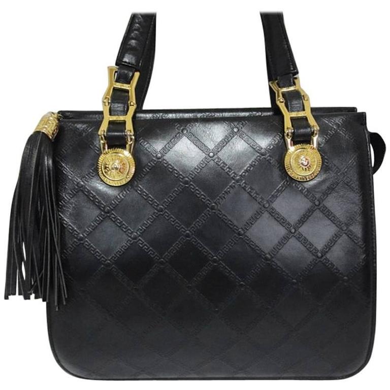 Vintage Gianni Versace black leather tote bag with a tassel and ...