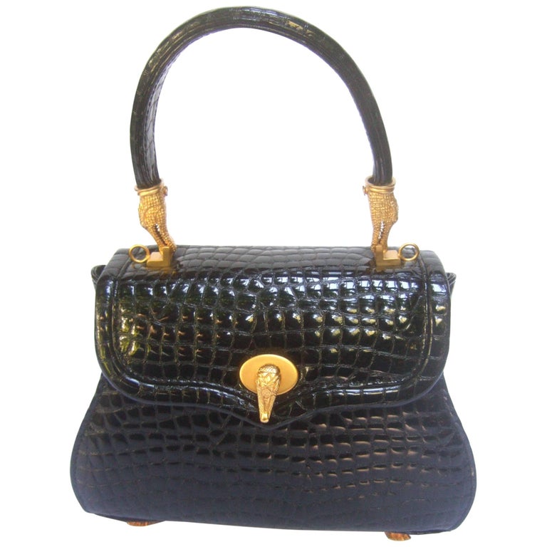 Posh Ebony Embossed Gilt Alligator Emblem Handbag at 1stDibs