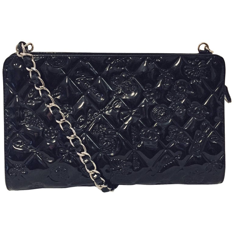 Chanel Black Patent Shoulder Bag Embossed With Signature Trademarks and ...