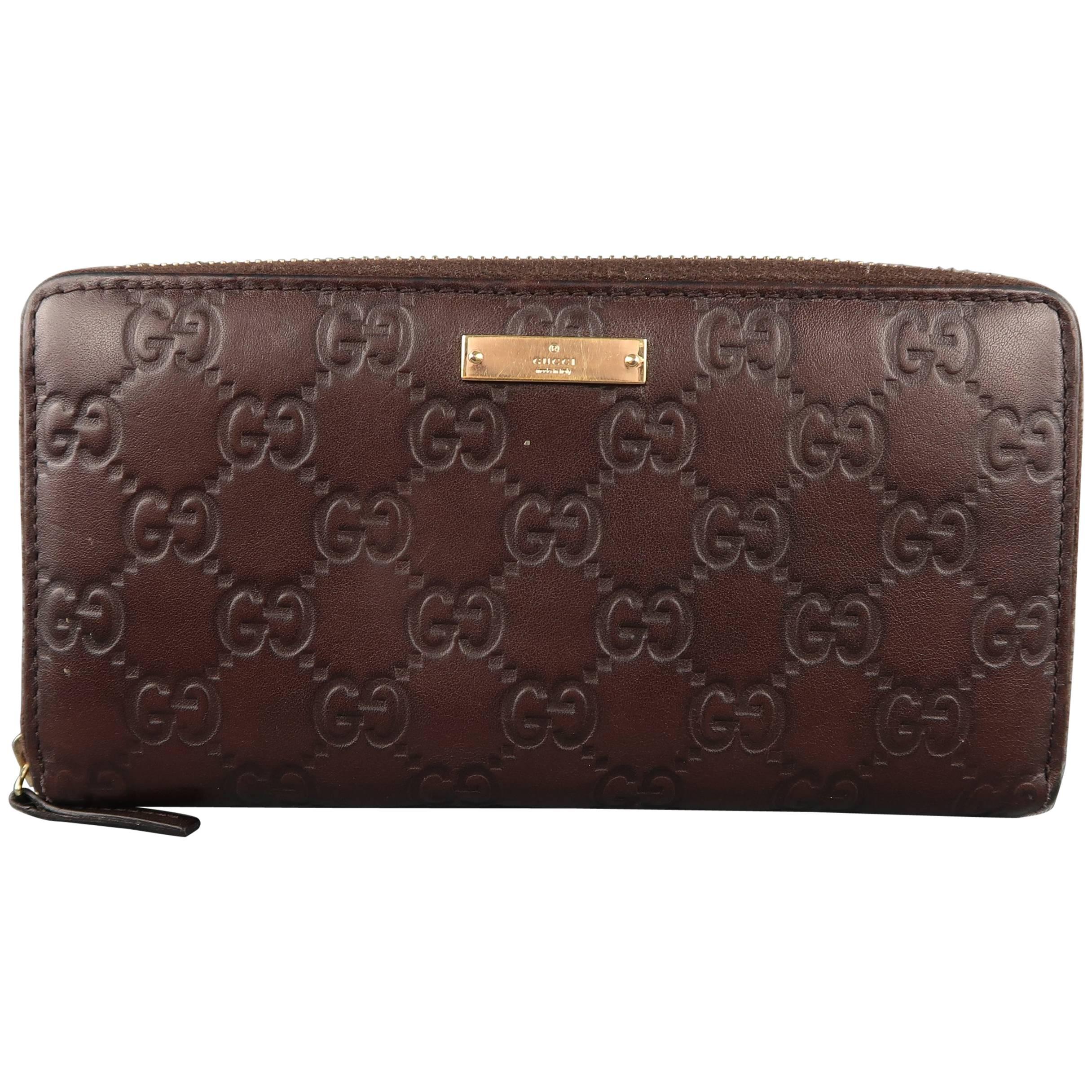 Gucci Brown Monogram Embossed Leather Zip Pocket Book Wallet at 1stDibs